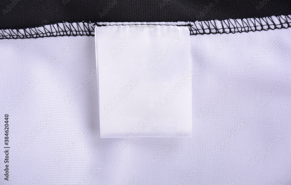 White blank clothing tag label on shirt fabric texture background Stock ...