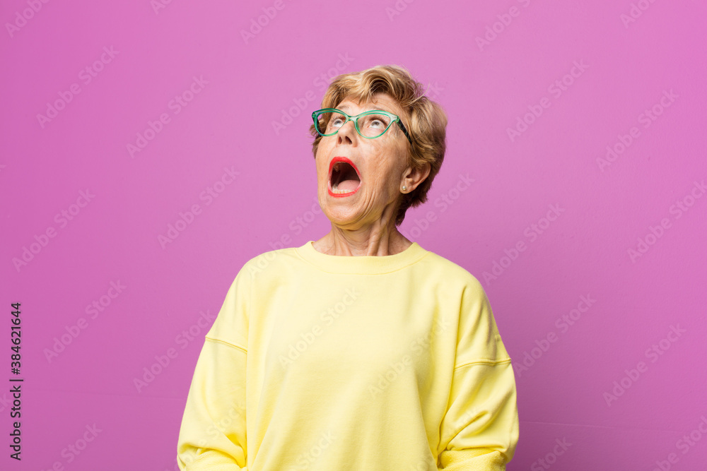 old pretty woman screaming furiously, shouting aggressively, looking ...