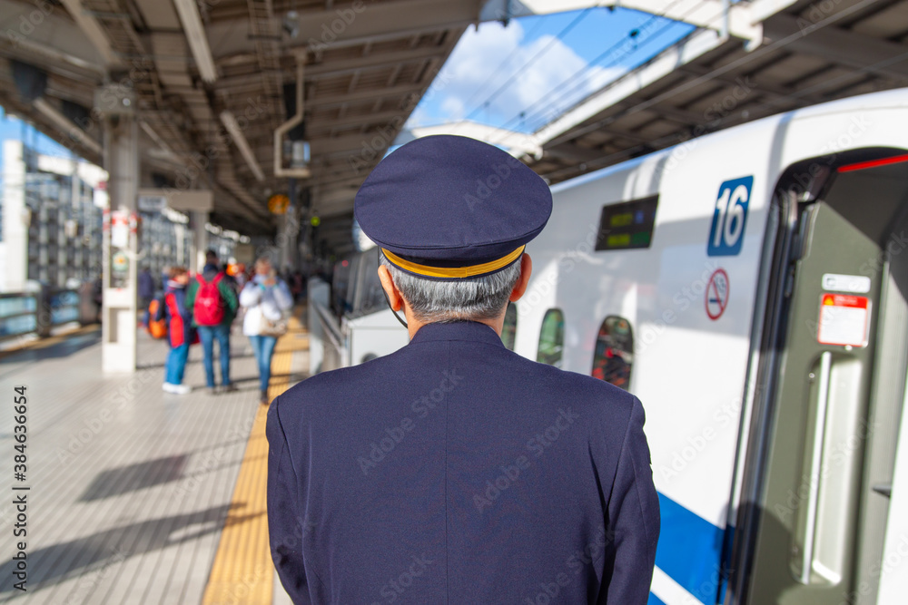 Poster Shinkansen Nozomi Bullet train conductor checks the platform as ...