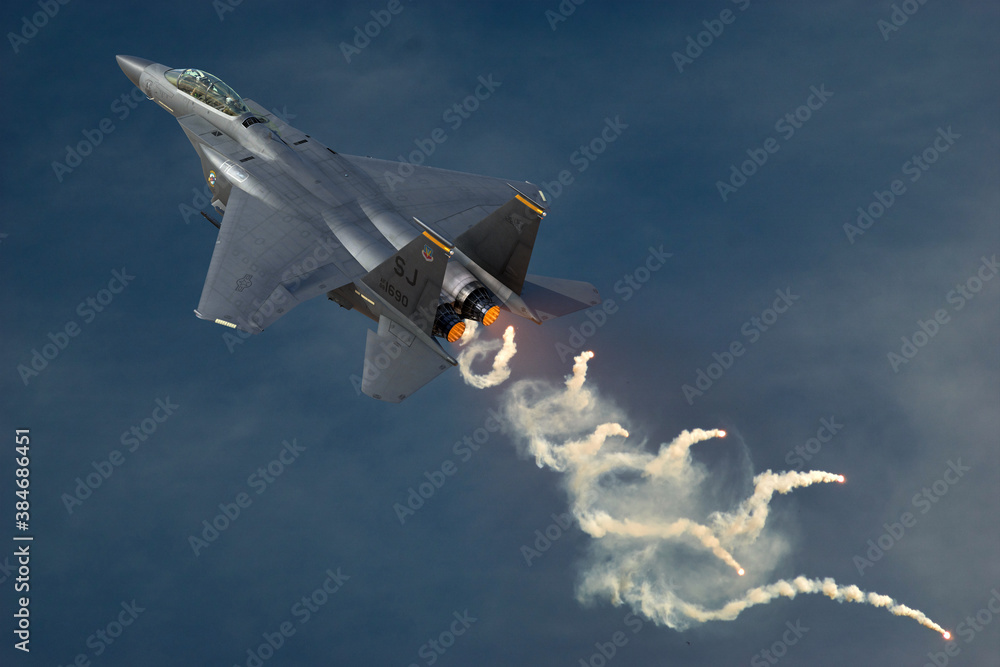 Boeing F-15E Strike Eagle during a defensive maneuver, discharging ...