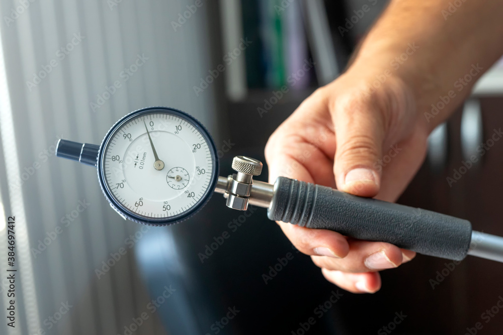 View of the runout gage (gauge) and indicator. Runout gages ensure ...
