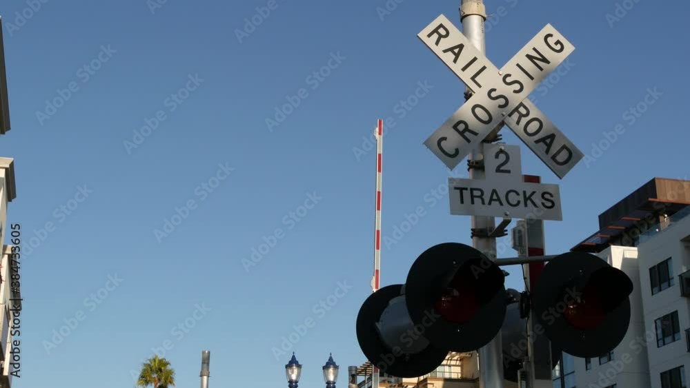 Level crossing warning signal in USA. Crossbuck notice and red traffic ...