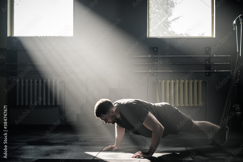 Muscular Man Do Push Ups at Male Gym . Stock Photo | Adobe Stock