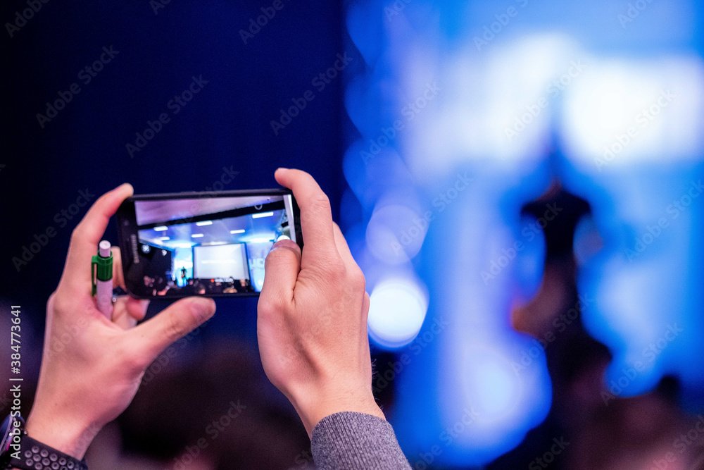 Filming a Business Conference Event With a Smartphone Stock Photo ...