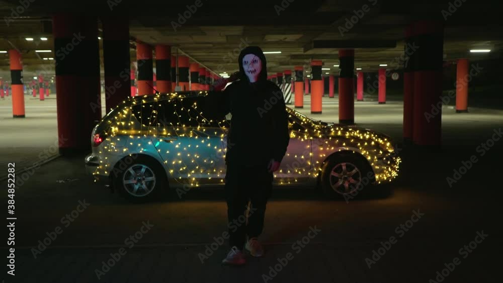 Man in scary white mask mask are holding a baseball bat. Murderers at ...