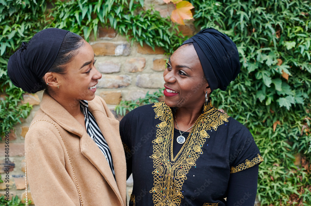 Muslim mom and daughter smiling outside Stock Photo | Adobe Stock
