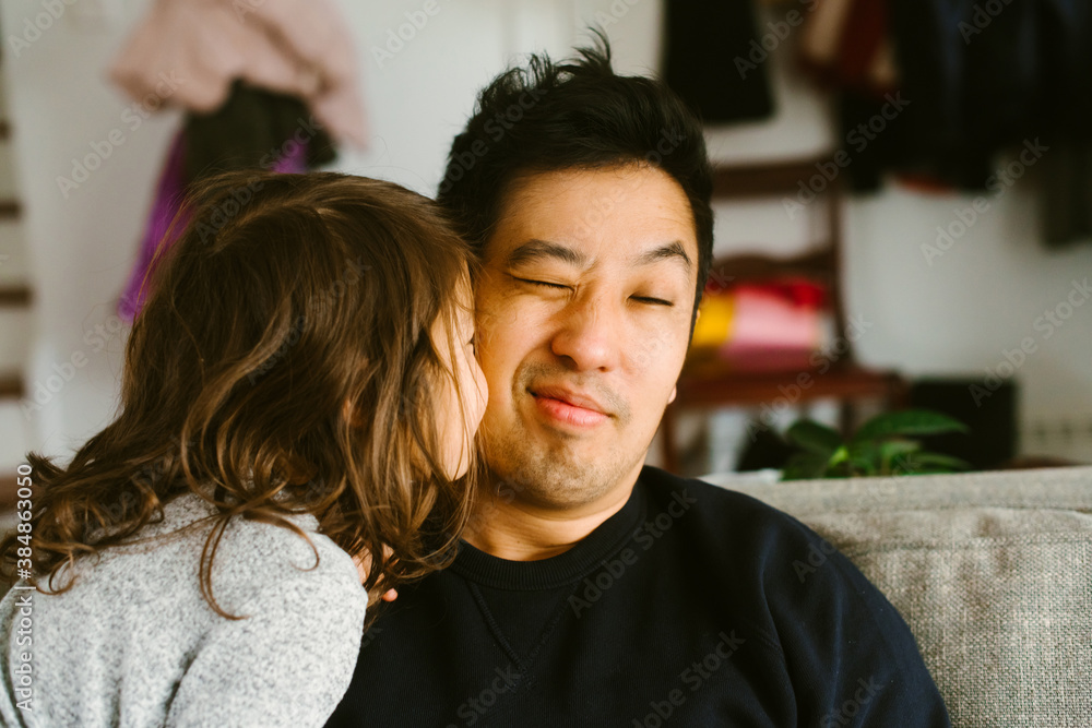 Little kid kissing dad's cheek Stock Photo | Adobe Stock