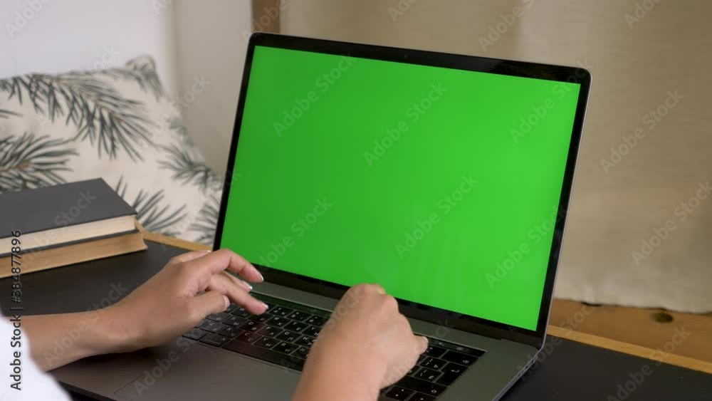 Over the shoulder shot of a business woman working in office interior ...