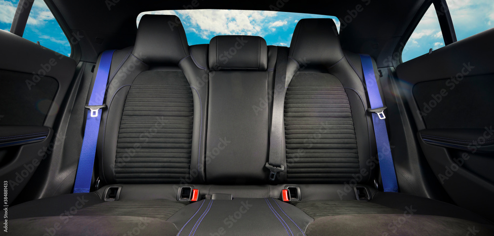 Back passenger seats in modern luxury car, frontal view, black leather ...