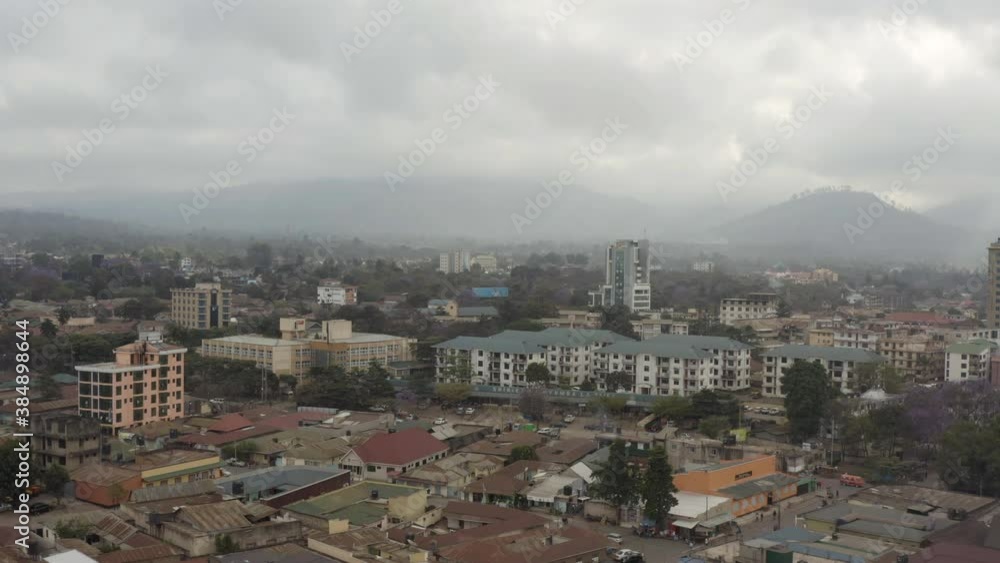 Drone video of city streets, transport, where you can see old houses ...