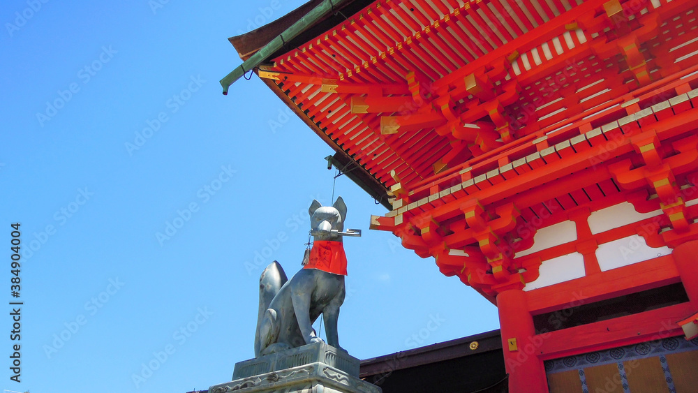 Japanese shinto shrine temple dog statue holding key in his mouth with ...