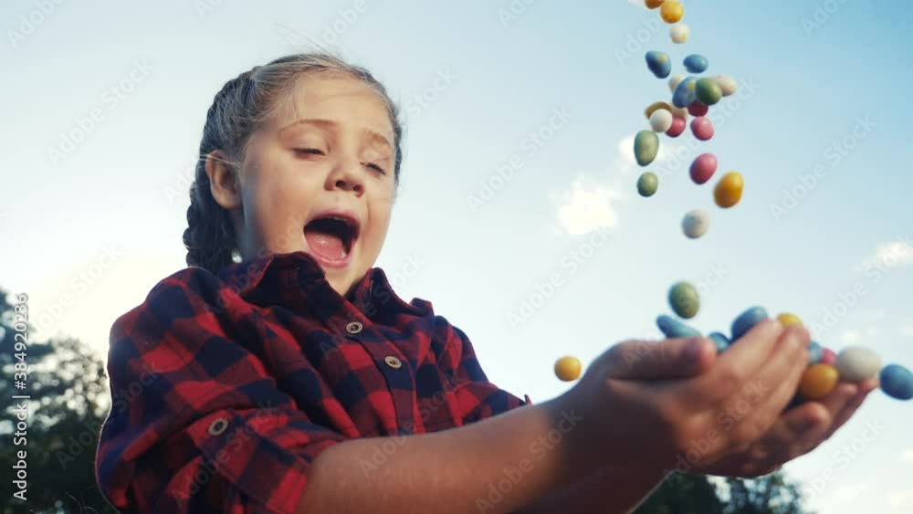 kid fun dream concept. little girl catches with her hands a large ...