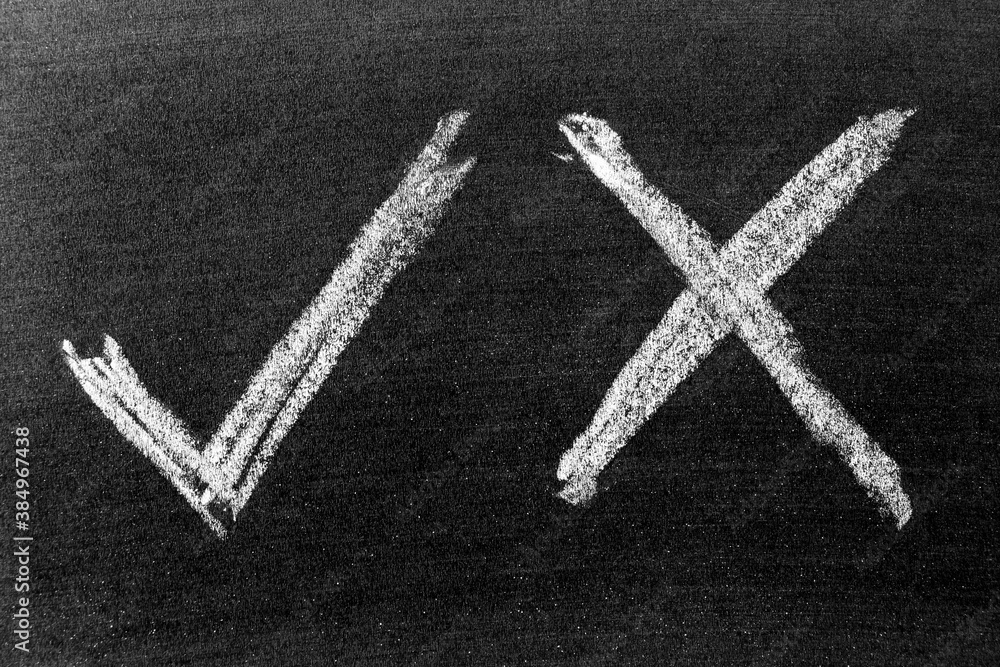 White color chalk hand drawing in check mark of right and wrong shape ...