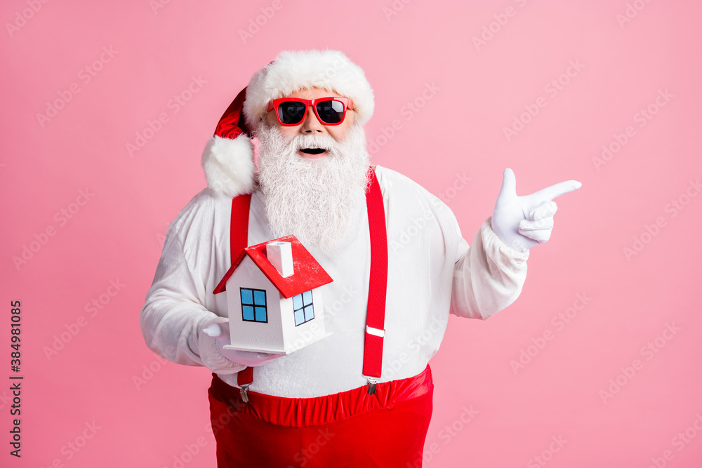 Portrait of his he nice attractive cheerful Santa holding in hands ...