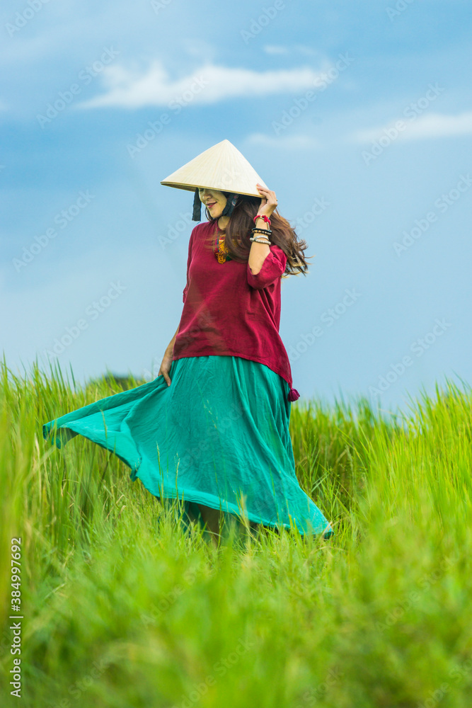 Vietnamese girl in dark red and bottle green traditional costume dress ...
