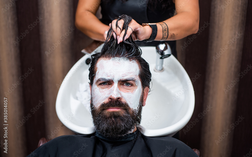 bearded man has cream foam on face. hairdresser. beauty and fashion ...