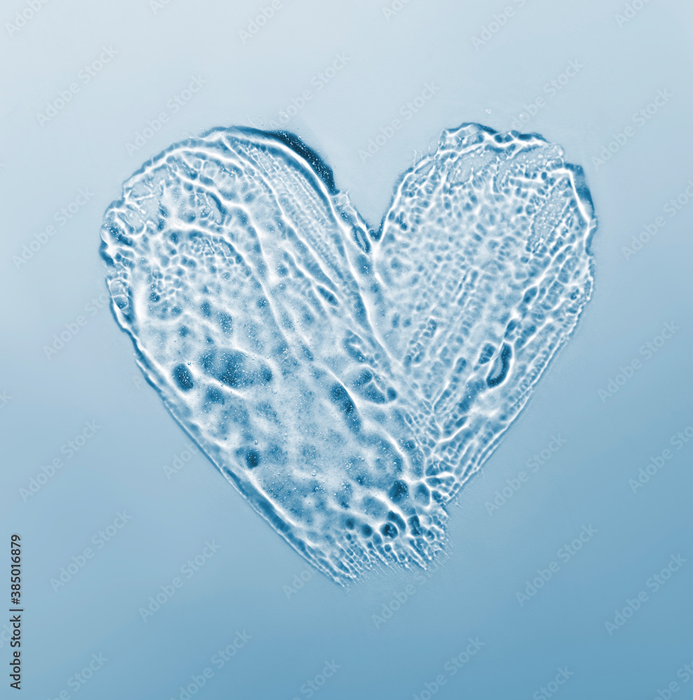 Transparent gel with bubbles close-up. Smear of face gel cream. The ...