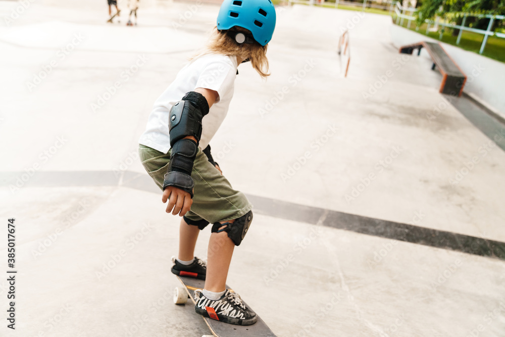 Young boy wearing safety gear Stock Photo | Adobe Stock