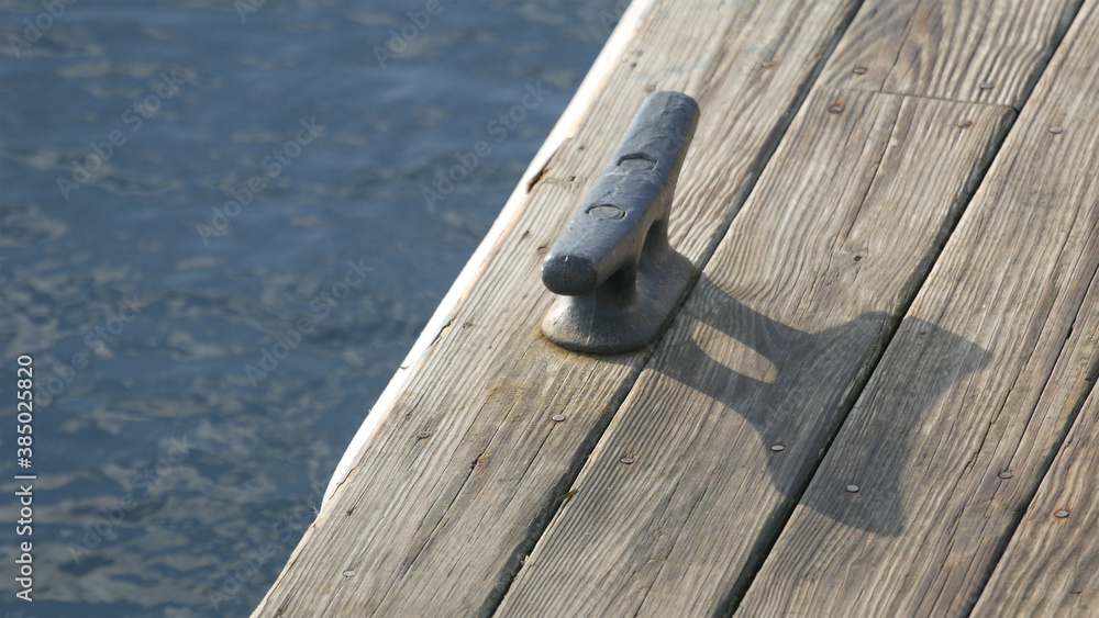 Dock cleat fastened to a floating dock on the sea. Stock Photo | Adobe ...