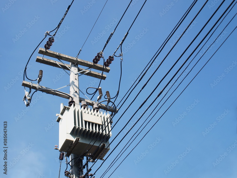 Transformer with wires on the pole. The three-phase converter and fuse ...