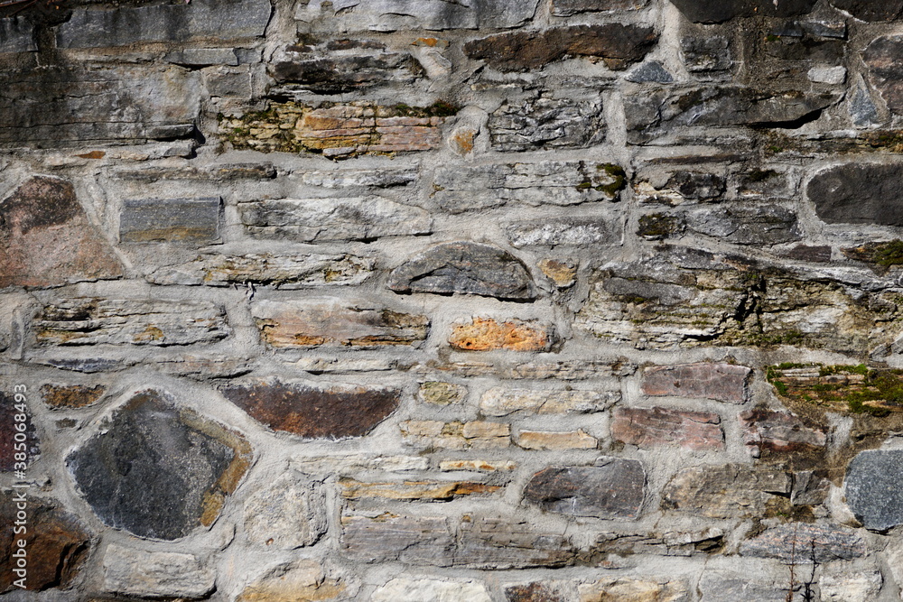 Full frame of an old stone wall built in the 18th century from the ...