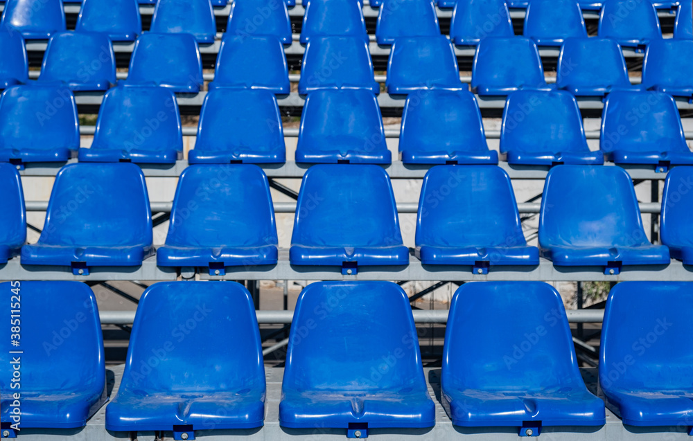 Poster Stadium seats background. Rows of blue plastic empty chairs ...