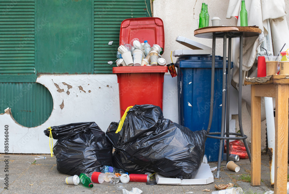 Trash laying around on a city streets Stock Photo | Adobe Stock