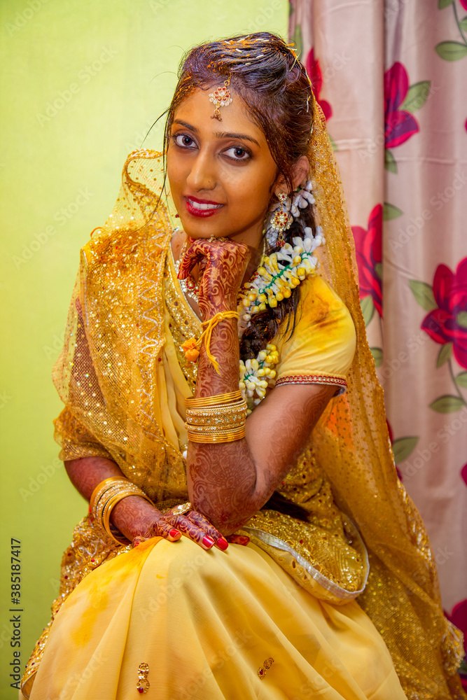 portrait of Indian bride with saree on her Haldi ceremony ,painted with ...