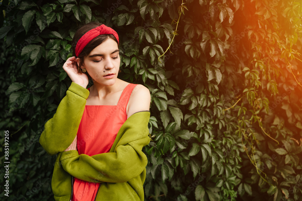 Attractive young fashion style teenager girl shyly embarrassed looking ...