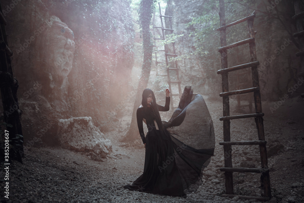 Fantasy horror woman witch in black dress. Stock Photo | Adobe Stock