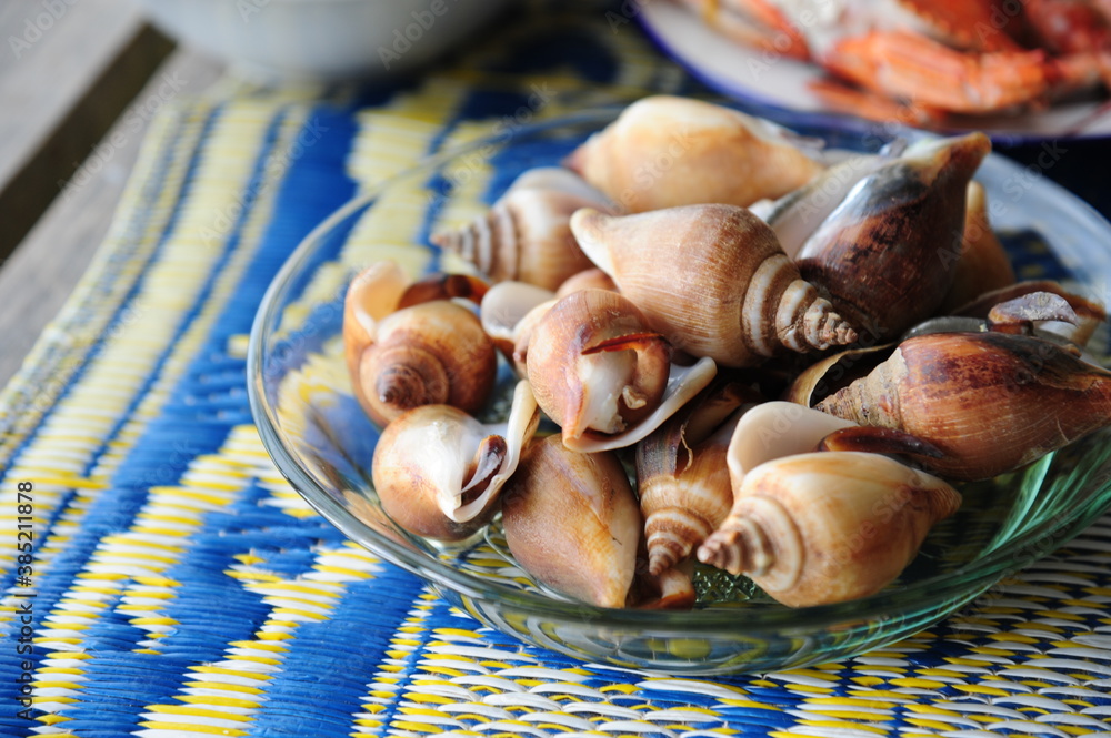 Soft-boiled fresh wing shell, Laevistrombus canarium, dog conch, served ...