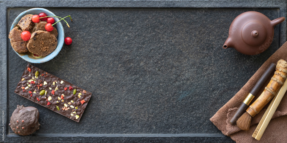 Tea party on a black stone table in the style of a traditional Chinese ...