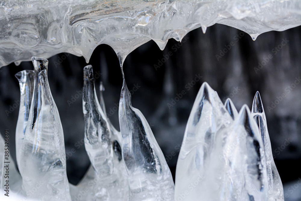 Ice forms pillars beneath an upheaved sheet of ice at Copper Falls ...