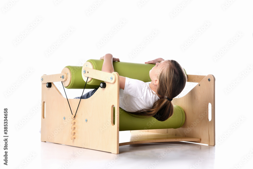 Smiling little child demonstrating usage of exercise set for persons ...