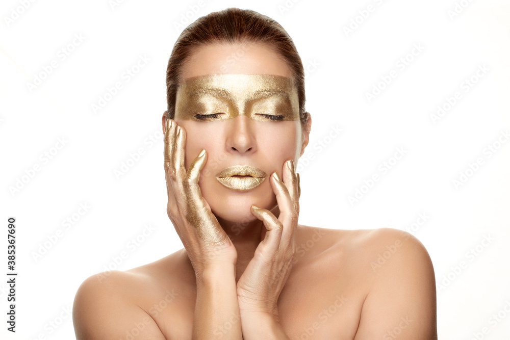 Gold based skincare concept. Beauty woman face with gold mask ...