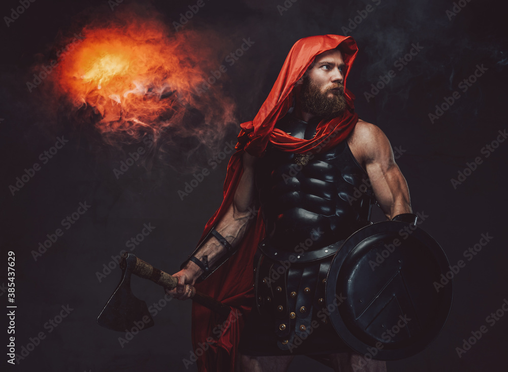Military bearded roman in red hood and dark armor which holding an axe ...