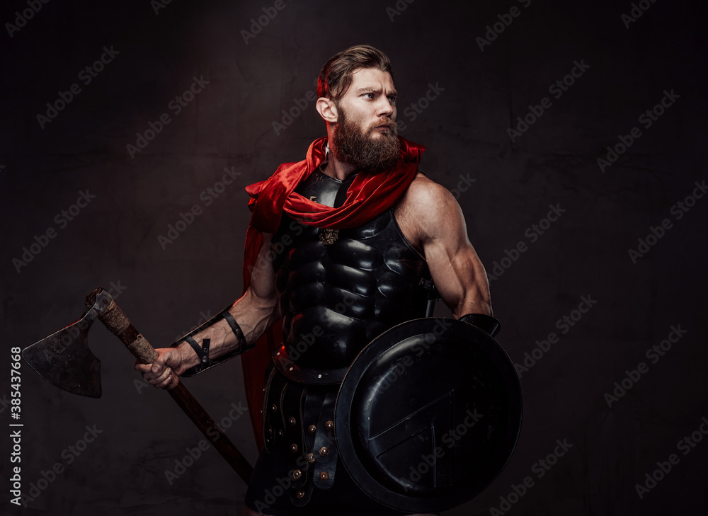Ancient greek fighter in black armor and red mantle posing standing in ...