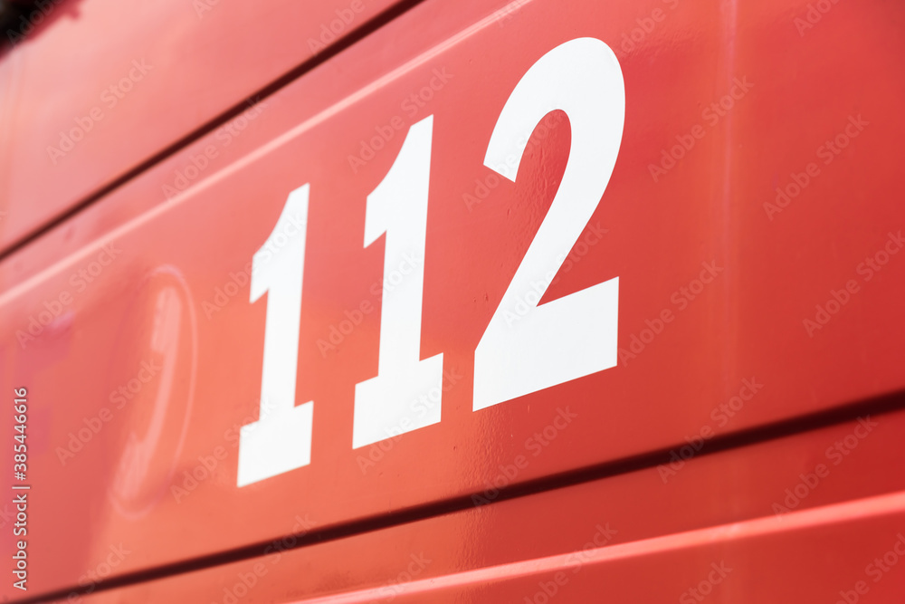112 the emergency number on a red background Stock Photo | Adobe Stock