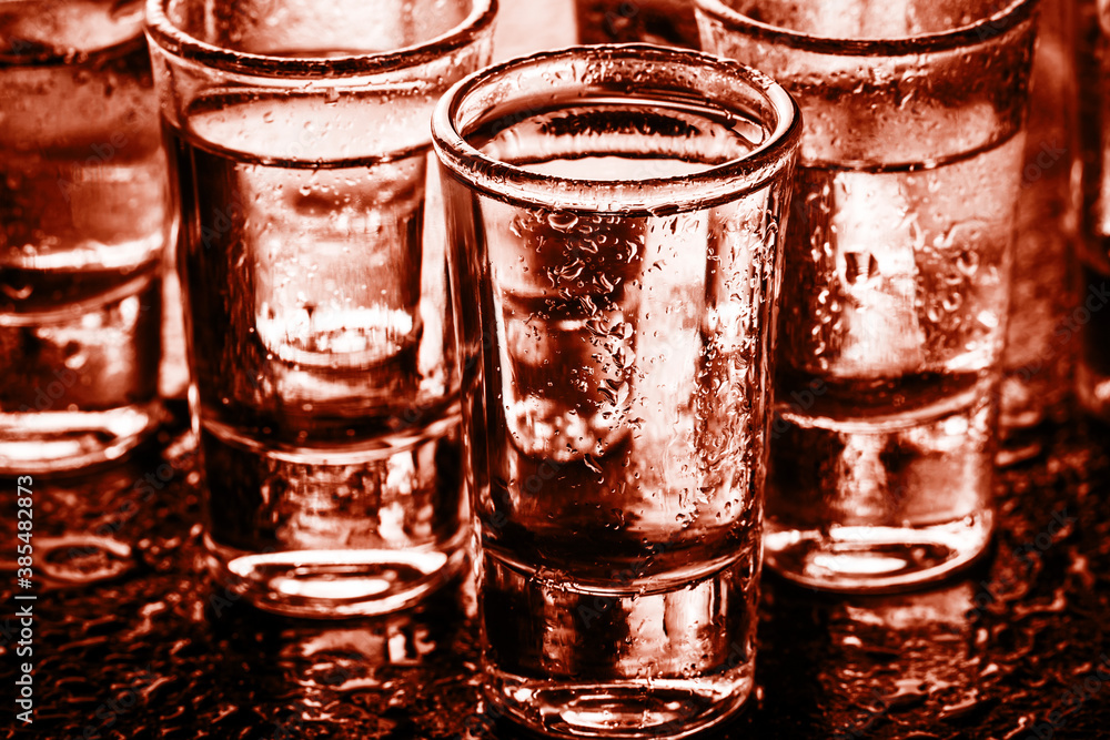 Glass vodka shots. Alcohol drinks in a row texture. Weekend party ...