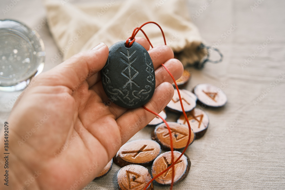 rune stone good luck and riches talisman with runescript Stock Photo ...