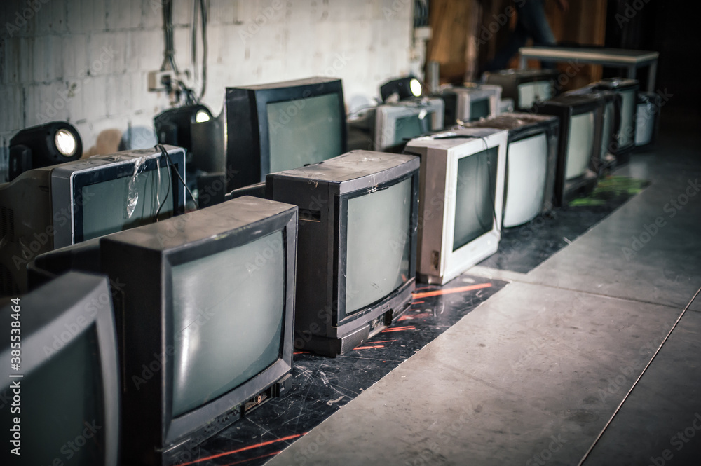 Stack of retro vintage televisions stacked. Lifestyle details, old TV ...
