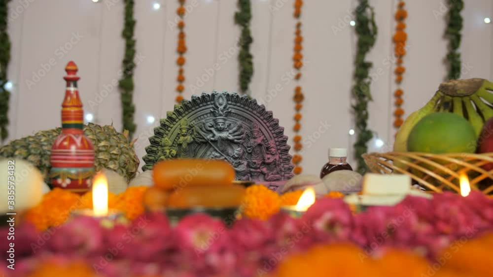 Pan shot of a beautifully decorated platform with Hindu idol Goddess ...