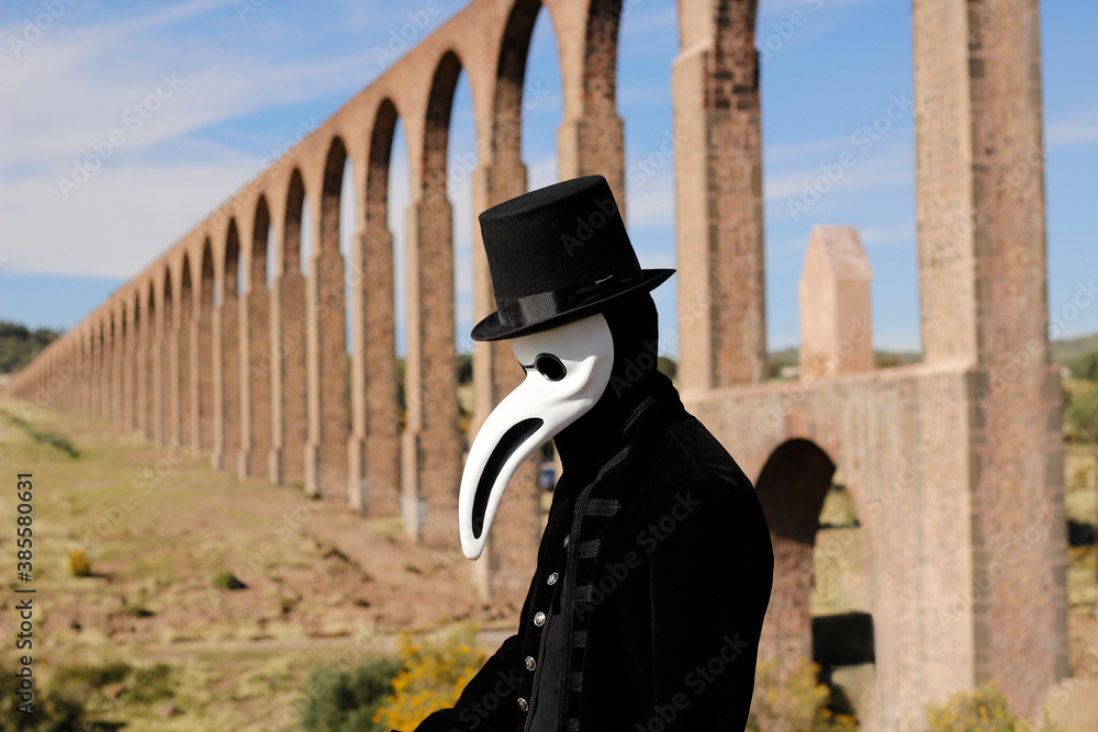Creepy costume of a doctor from the last century in an open field Stock ...