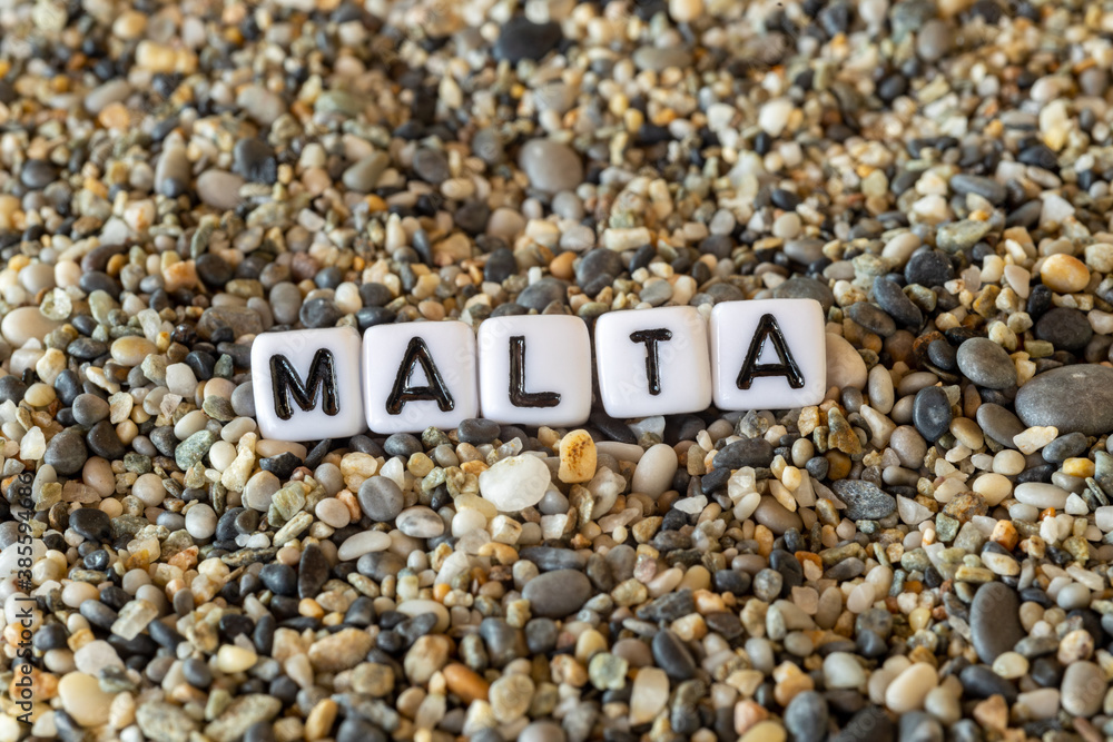 Malta inscription text with name of the vacation destination city in a ...