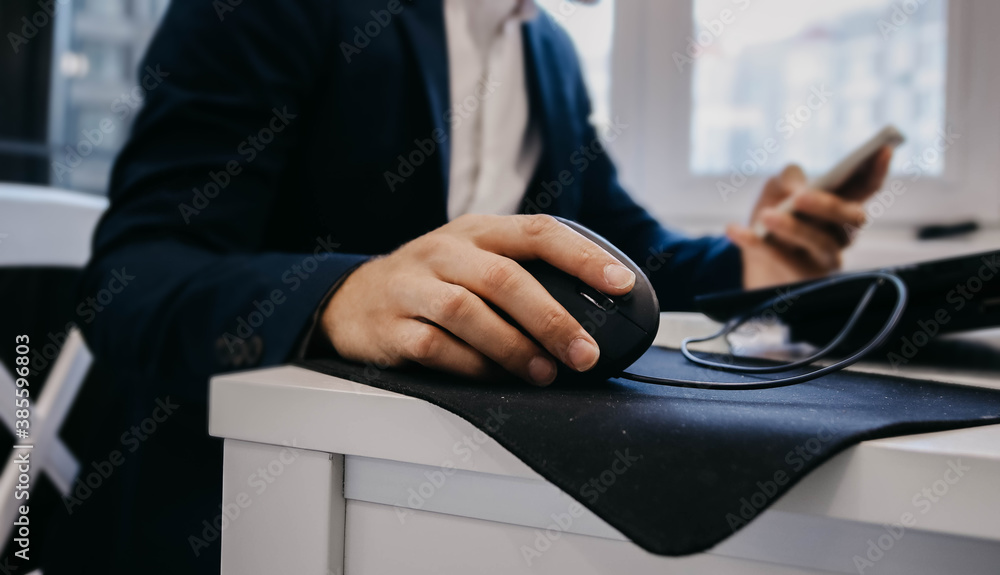office worker uses an ergonomic vertical computer mouse Stock Photo ...
