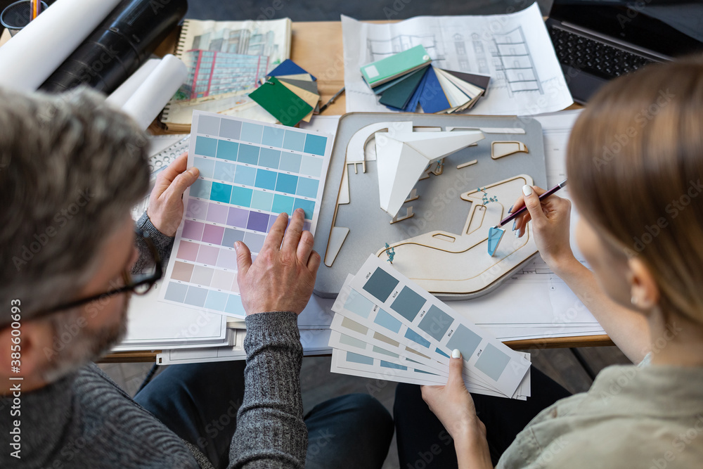 Interior designers team working in office with color palette ...