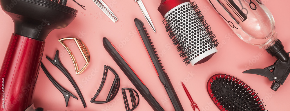 professional items for hairdressing, haircuts on a pink background ...