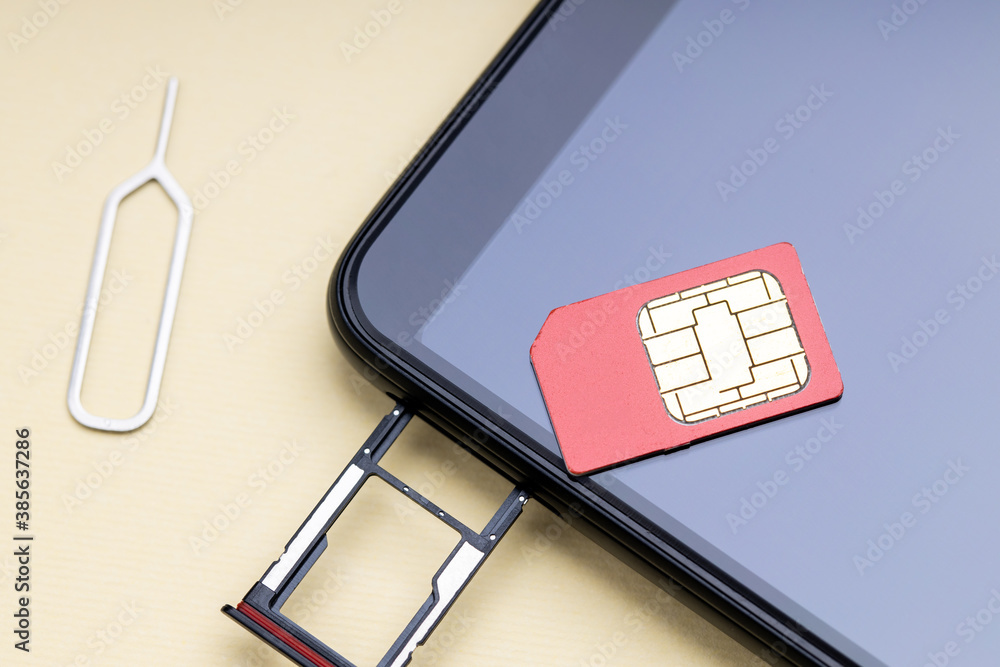 mobile phone or smartphone and variation of sim cards. different kinds ...
