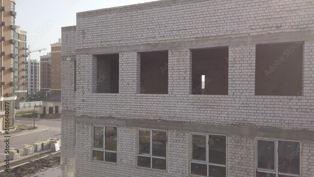 Unfinished house construction. White brick on the background of the ...