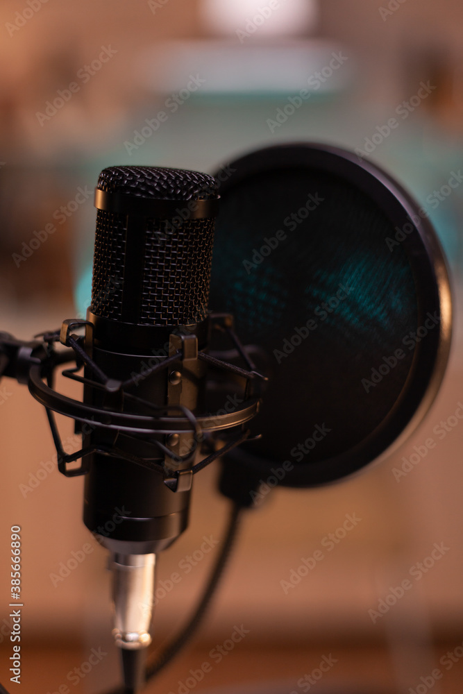 Zooming on professional microphone in vlogger home studio and neon ...